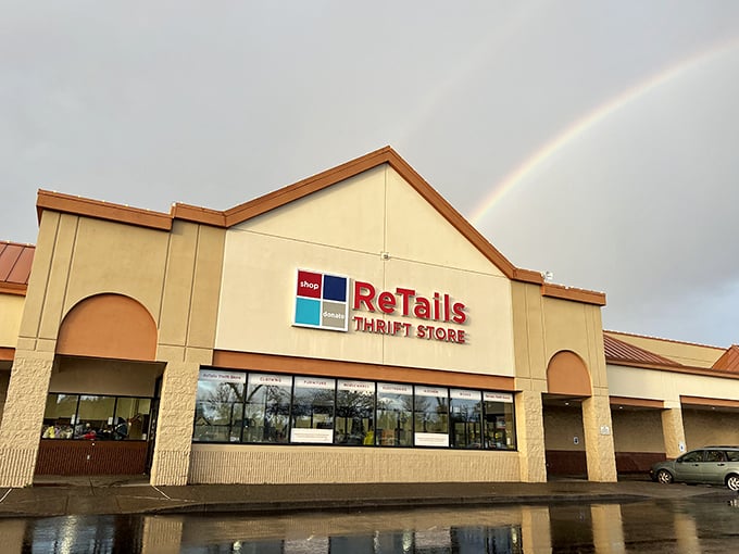 A rainbow arches over ReTails like nature's own "Open" sign, promising treasure hunters a pot of second-hand gold within those beige walls.