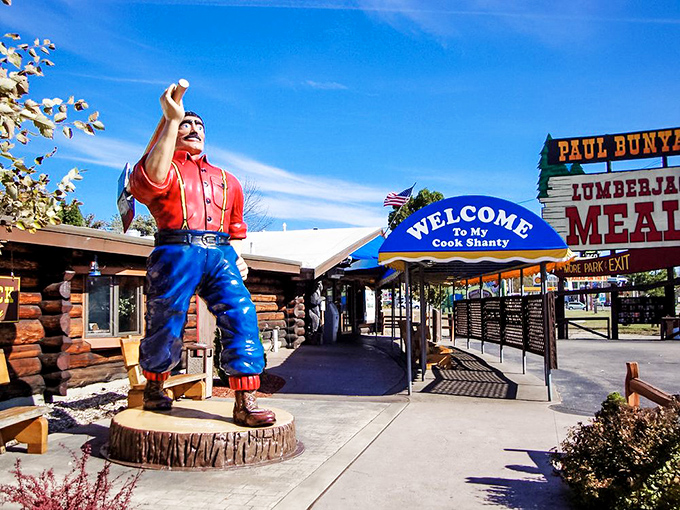 The legendary Paul Bunyan welcomes hungry travelers with a sign that practically shouts "FOOD!" louder than a lumberjack yelling "TIMBER!"