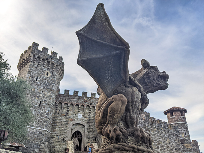 The castle's imposing entrance, complete with menacing gargoyle guardian, makes Disney's Cinderella Castle look like a starter home. Medieval intimidation meets California sunshine.