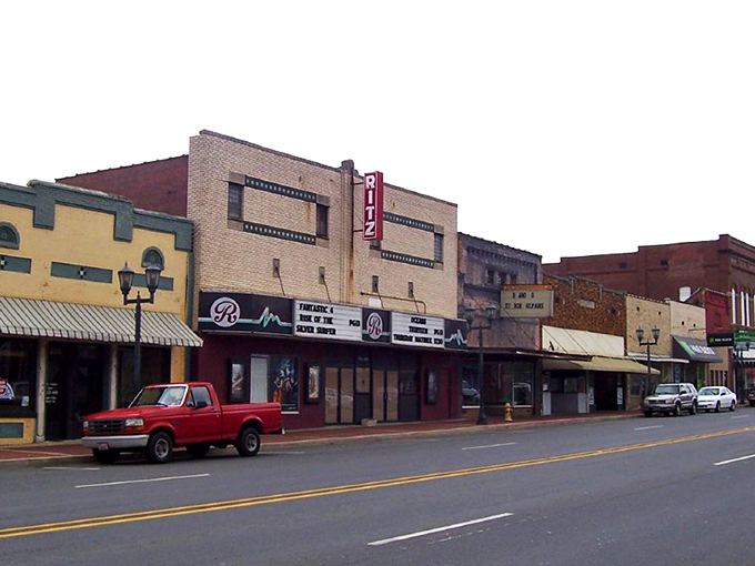 Malvern's Main Street at dusk captures that perfect small-town moment when the streetlights flicker on and the brick buildings glow with warmth and history.