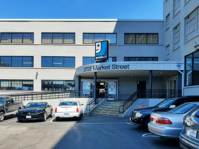 The unassuming exterior of bargain-hunting paradise at 3728 Market Street. Behind these doors, Missouri's most determined thrifters prepare for retail adventure. 