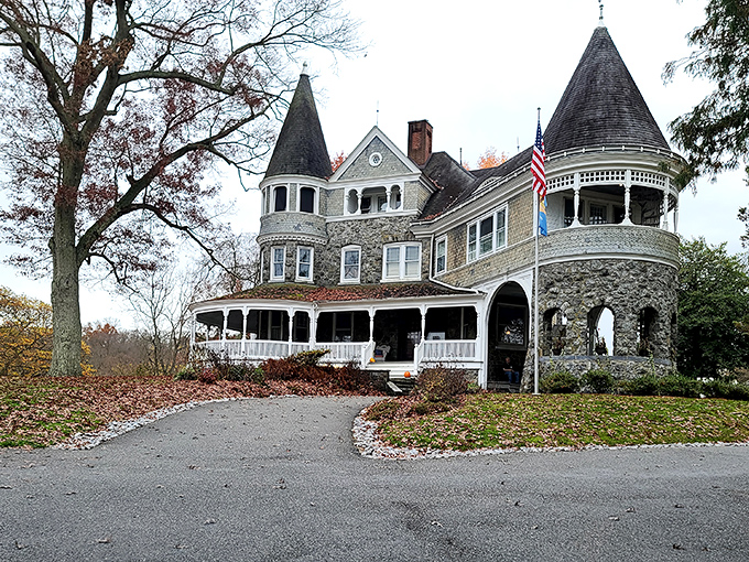 Auburn Heights mansion stands like a Victorian dream, its turret and wrap-around porch whispering tales of Gilded Age splendor and steam-powered adventures.