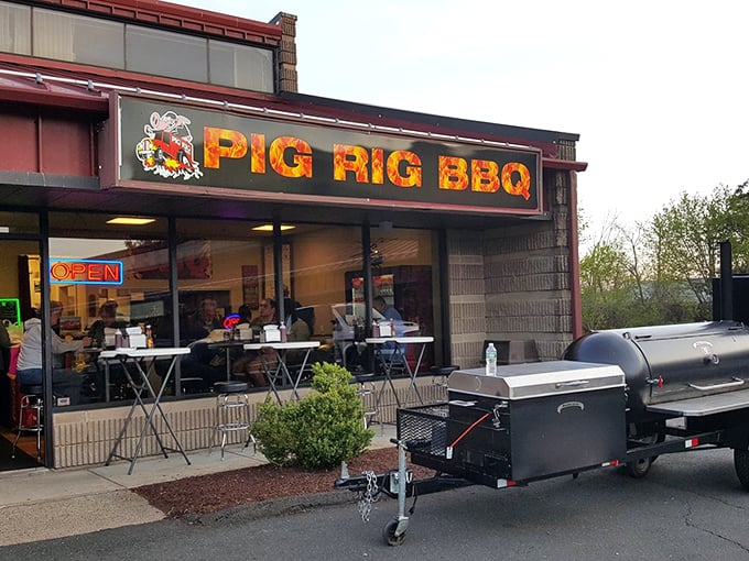 The unassuming exterior of Pig Rig BBQ in Wallingford hides a smoky paradise within. Like finding a diamond in the rough, but the diamond is brisket.