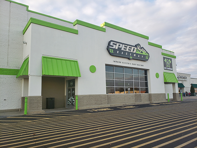 The vibrant green exterior beckons speed enthusiasts like a neon sign in the desert. Racing paradise awaits behind those unassuming walls.