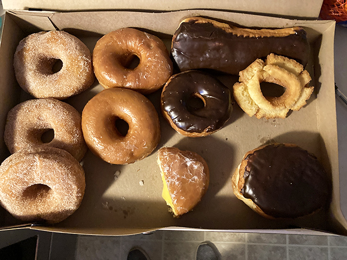 A dozen donuts from Cork's isn't just breakfast—it's an insurance policy against having a bad day, neatly packaged in a cardboard box.