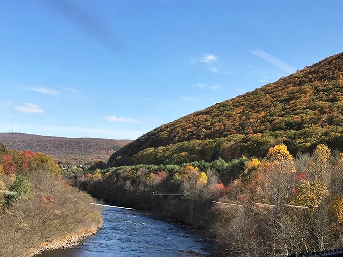 The Lehigh River carves its ancient path through mountains dressed in their autumn finest. Mother Nature showing off her seasonal wardrobe with no fashion police in sight.