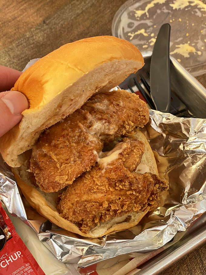 This sandwich isn't just food; it's an experience worth crossing state lines for, nestled between pillowy buns.