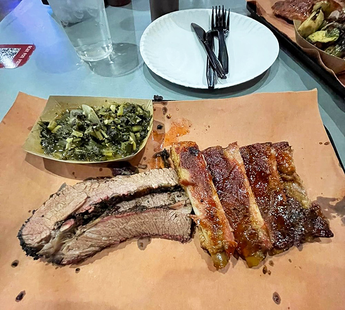 Brisket and ribs sharing butcher paper real estate&mdash;a meat neighborhood where everyone gets along deliciously.