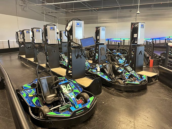 Karts await their next drivers, electric chariots numbered and ready. The smell of rubber and competition hangs in the air.