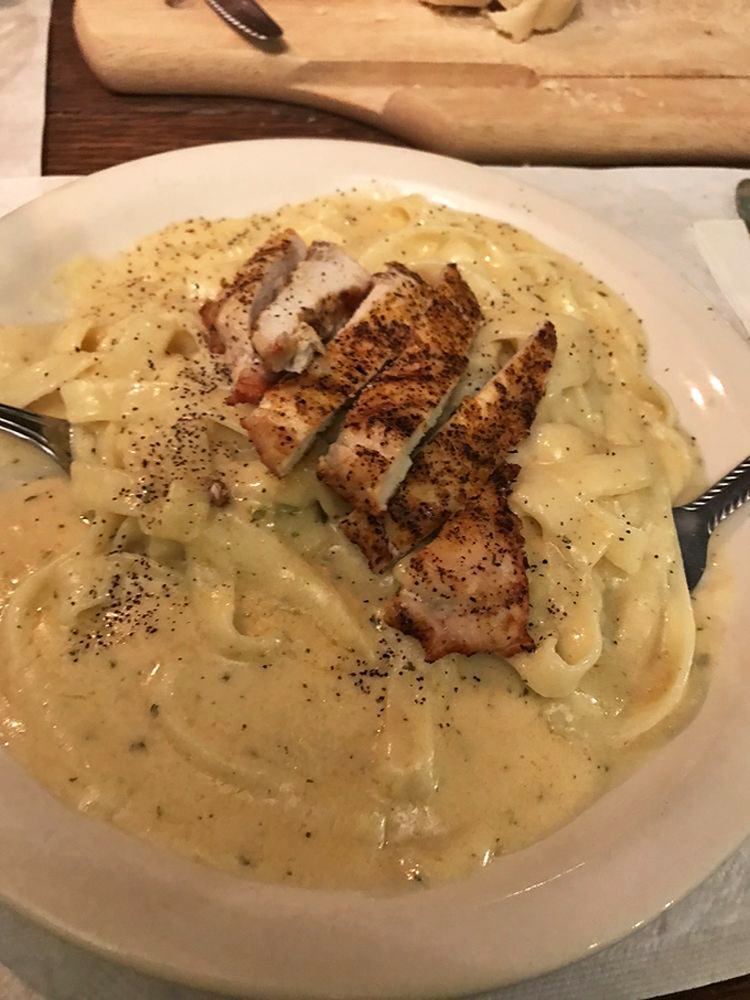 Fettuccine Alfredo so creamy it should come with a warning label. That grilled chicken isn't just a topping&mdash;it's the perfect dance partner.