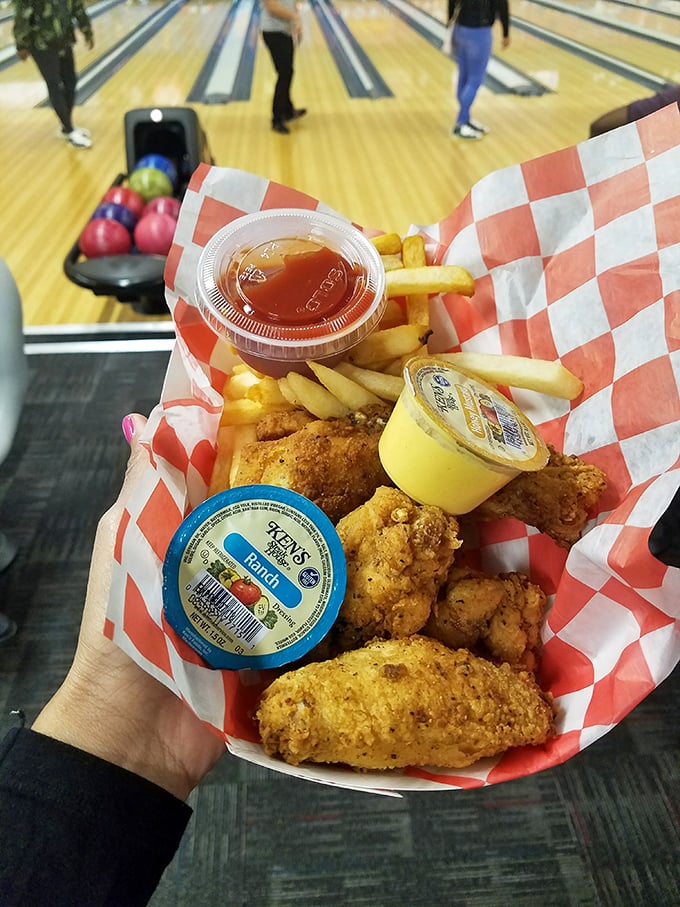 Bowling alley chicken tenders and fries - proof that some food tastes infinitely better when eaten between frames.