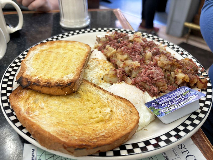 Corned beef hash with perfectly runny eggs &ndash; the breakfast that says, "Go back to bed, lunch. We've got this covered."