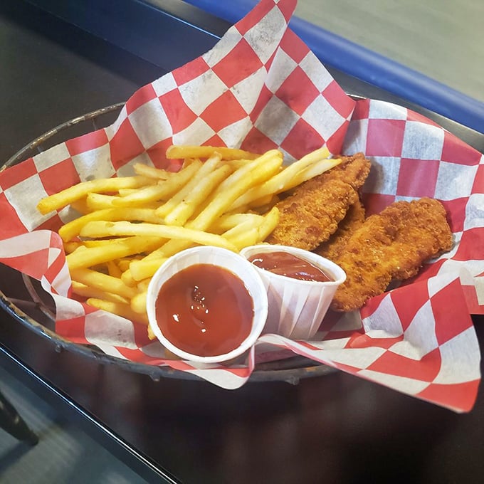 Chicken strips and fries served in checkered paper&mdash;because racing royalty deserves a throne-worthy meal between victory laps.