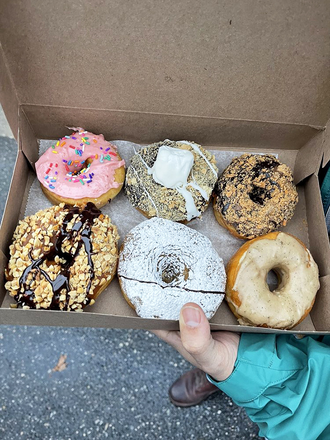 Holding this box feels like carrying treasure. The powdered sugar one is practically glowing, like it knows it's the star of the show.