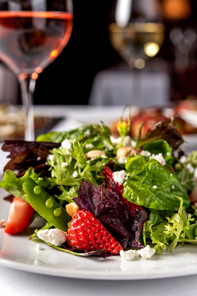 Their house salad features strawberries and greens so fresh they could make a rabbit question its life choices.
