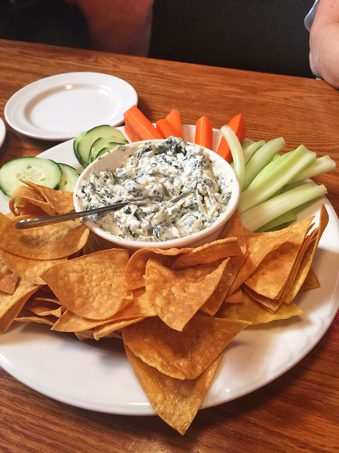 This spinach dip surrounded by fresh veggies and tortilla chips isn't just an appetizer&mdash;it's the opening act that sets the tone for greatness to follow.