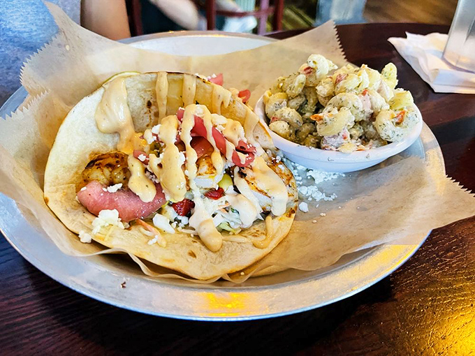 Someone had the brilliant idea to combine seafood, tortillas, and creamy sauce into a handheld delivery system for pure joy.