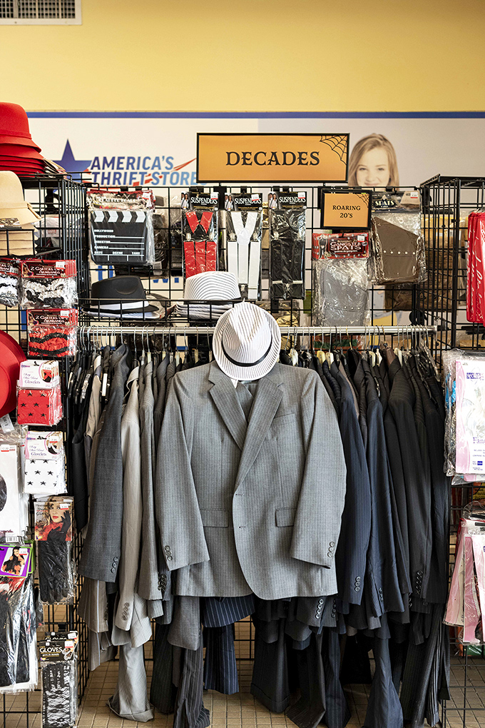 The "Decades" section offers a time-traveling wardrobe experience. That fedora and pinstripe suit? Pure Gatsby glamour at yard sale prices.