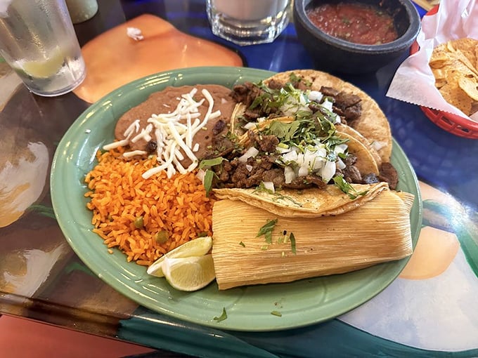 Tamales and tacos: the dynamic duo of satisfaction. Fresh cilantro, lime, and perfectly seasoned fillings create a plate that speaks fluent comfort.