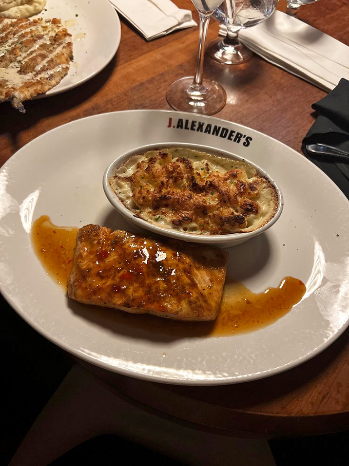 Salmon that's had an exciting vacation in Thailand and came back with stories to tell. That mac and cheese is listening intently.