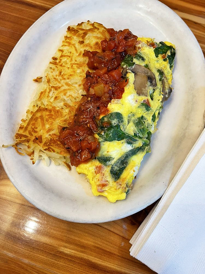 This vegetable omelette with its crispy hash brown sidekick proves that eating your veggies can be a morning adventure worth waking up for.