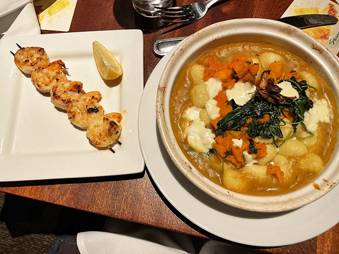 A tale of land and sea on one table&mdash;pillowy gnocchi nestled in seasonal vegetables while grilled shrimp stand at attention, ready for their close-up.