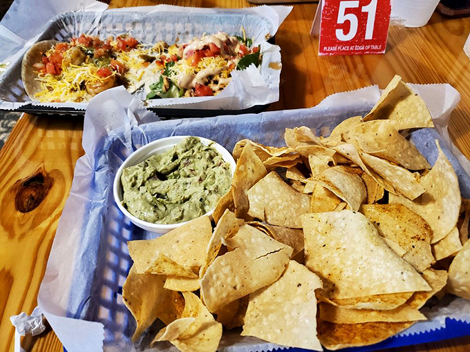 Guacamole and chips&mdash;the opening act that deserves a standing ovation. That wooden table has witnessed countless dipping techniques from novices to pros.
