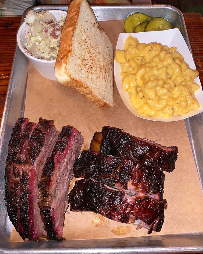 BBQ arithmetic: brisket + ribs + two sides = the plate that launches a thousand road trips to New Orleans.