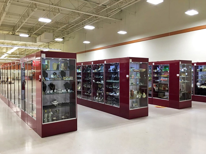 The glass display cases stand like sentinels guarding precious artifacts. Inside, collectibles large and small await their perfect match.