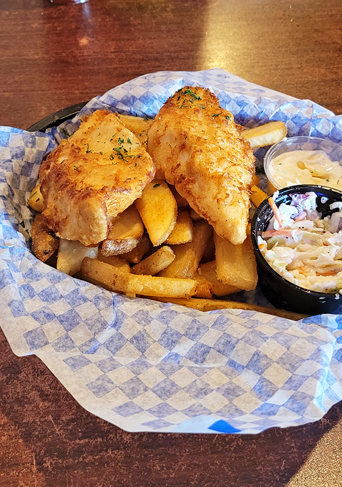 Golden-battered cod that shatters with each bite, nestled alongside fries that could start their own fan club.