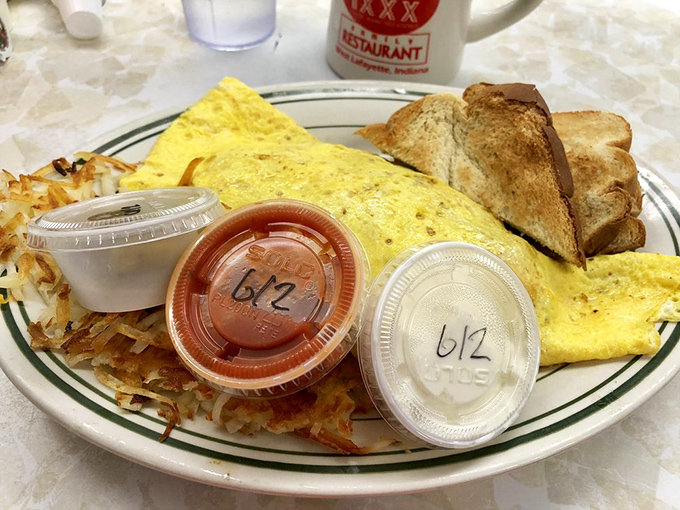 An omelet that's seen things, covered in gravy that's been places. Breakfast with gravitas and a side of serious carbs.
