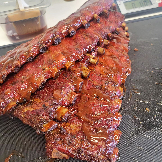 Ribs with a glaze that catches the light like stained glass. That bark has been earned through hours of patient smoking.