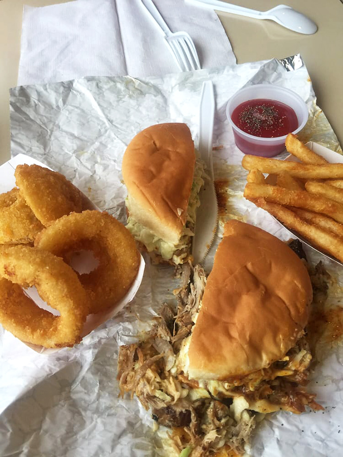 The BBQ sandwich with onion rings and fries isn't trying to impress food critics&mdash;it's busy making memories for generations of Arkansas families.