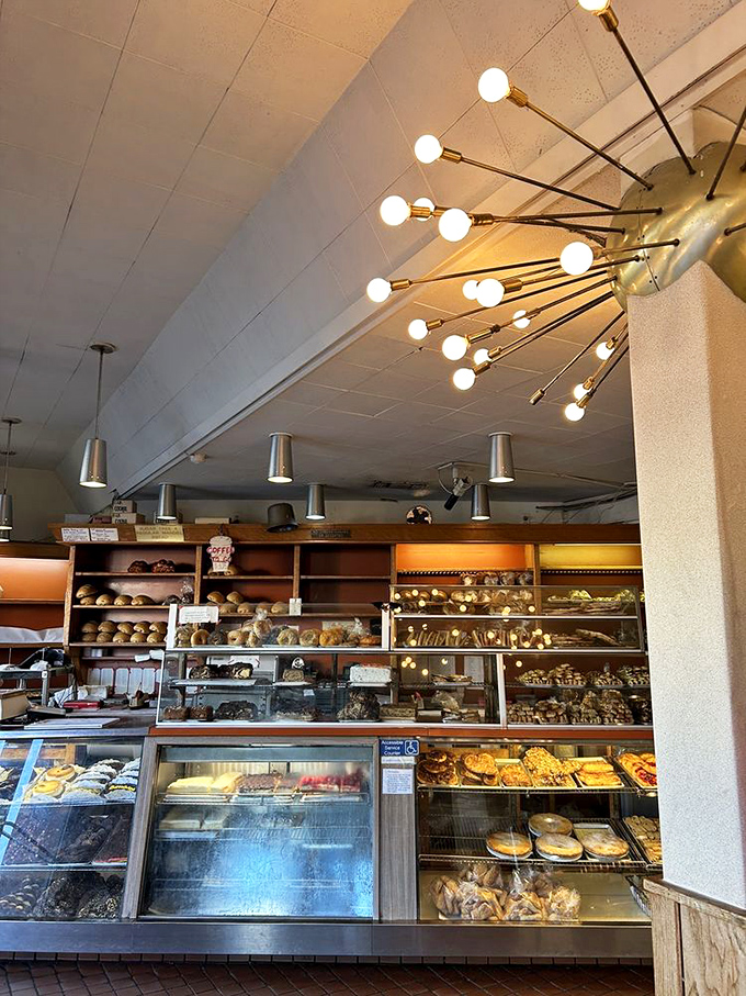 The bakery's starburst light fixture illuminates what might be the most important decision of your day: chocolate babka or rugelach? The correct answer is "both."