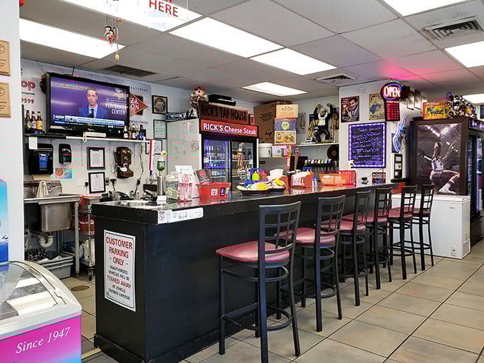 The counter where sandwich dreams come true. Sports on TV, cold drinks within reach, and the promise of imminent satisfaction hanging in the air.