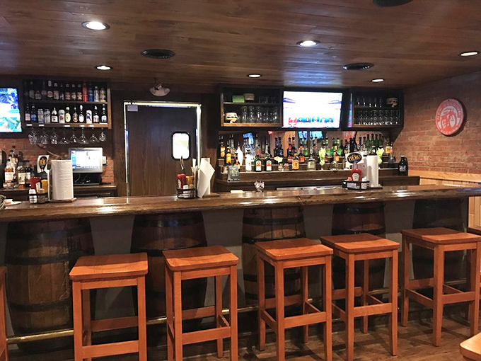 The bar area combines rustic charm with serious drinking infrastructure &ndash; barrel stools included, because themes matter.