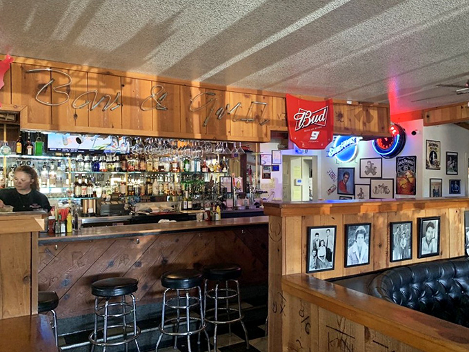 The bar doesn't just serve drinks&mdash;it serves history, with wood paneling and neon signs creating the perfect backdrop for stories both tall and true.