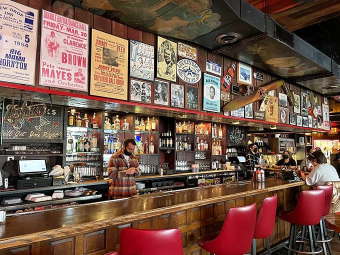 The wall of fame behind the bar tells stories of music legends while bartenders craft drinks worthy of accompanying smoked meat masterpieces.