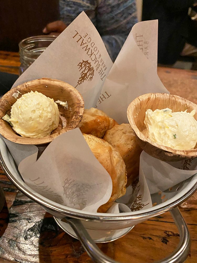 These aren't just biscuits&mdash;they're buttery clouds of happiness served with herb butter that makes you question all other butter relationships you've had.