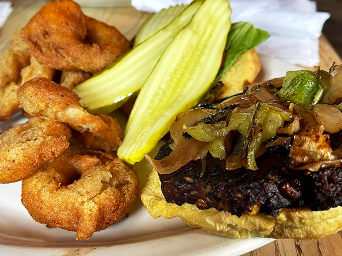 The black bean burger with grilled onions proves vegetarian options don't have to be punishment&mdash;they can be rebellion on a bun.