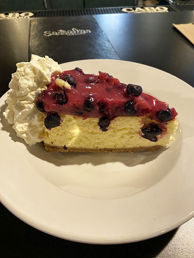 Blueberry cheesecake that makes you wonder why you ever waste calories on lesser desserts. That whipped cream isn't just a garnish&mdash;it's essential equipment.