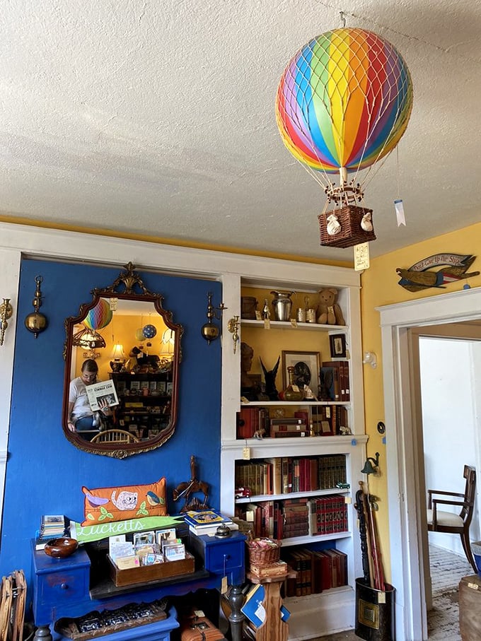 Miniature hot air balloons and vintage treasures float above everyday reality. This room doesn't just sell nostalgia&mdash;it throws it a party.
