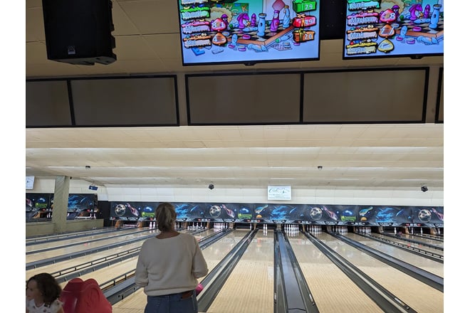 From this vantage point, you can almost hear the satisfying rumble of the ball and the thunderous crash of pins meeting their fate.