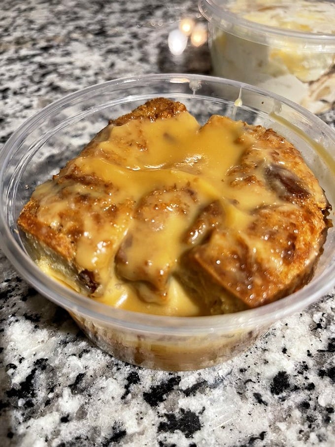 This bread pudding isn't just dessert; it's a warm, custardy hug drizzled with what appears to be a sauce worth bottling.