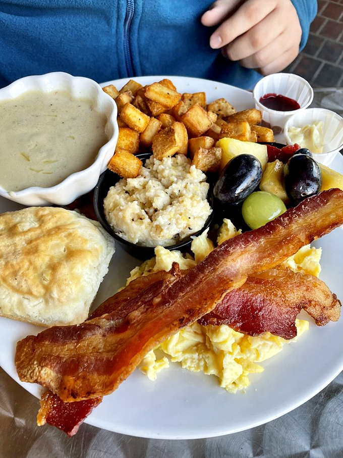 The breakfast sampler that ends all debates about what to order. That biscuit is so fluffy it could float away if not for gravity.