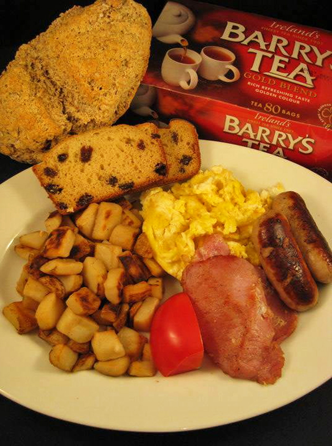 A proper Irish breakfast that laughs in the face of your avocado toast&mdash;eggs, rashers, sausage, potatoes, and soda bread with Barry's Tea standing by. Morning glory on a plate.