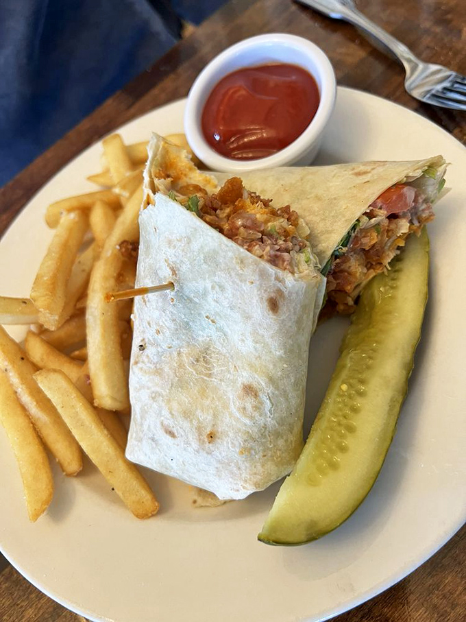 A wrap so perfectly constructed it could teach engineering classes. The pickle stands at attention, ready for its supporting role.