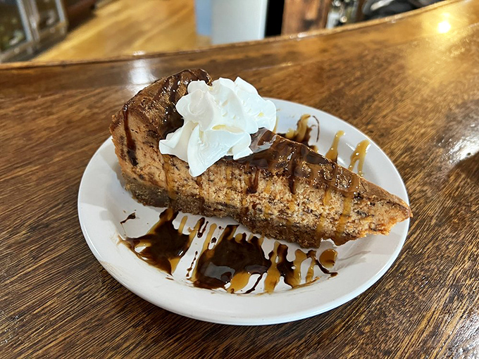 Not your average cheesecake! This Butterfinger-topped slice drizzled with caramel sauce is worth every delicious calorie.