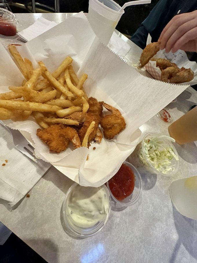 A seafood spread that makes sharing mandatory but regrettable. Those onion rings are the supporting actors that steal the show.