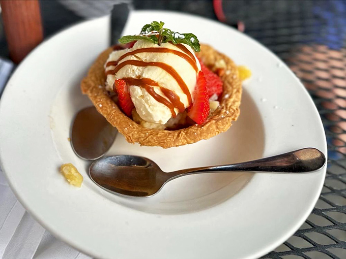 This isn't just dessert&mdash;it's edible architecture: a crispy caramel basket cradling ice cream and strawberries like precious cargo from the gods.